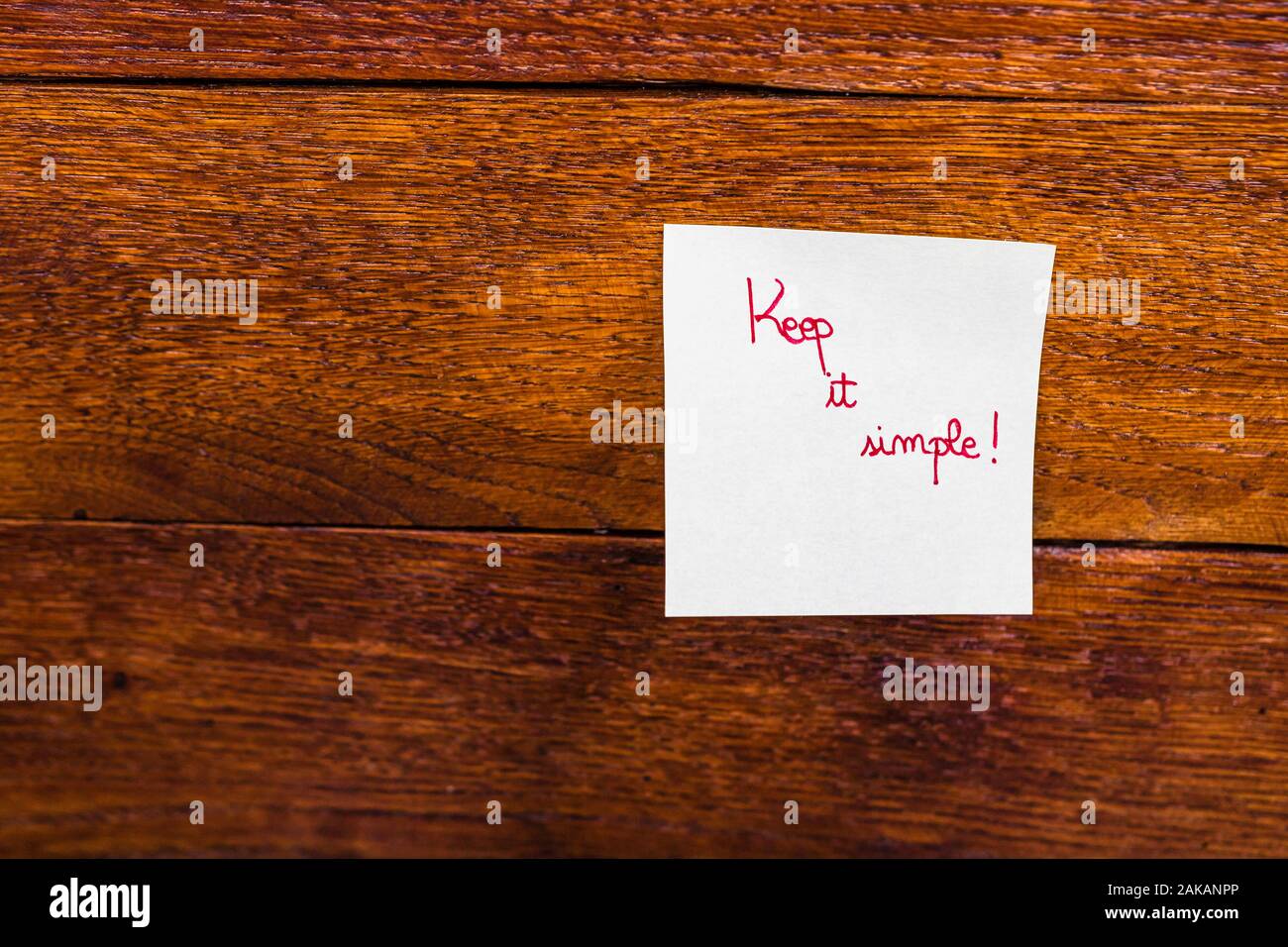 Text Keep it simple on post it. Writing on sticky note. Copy space ...