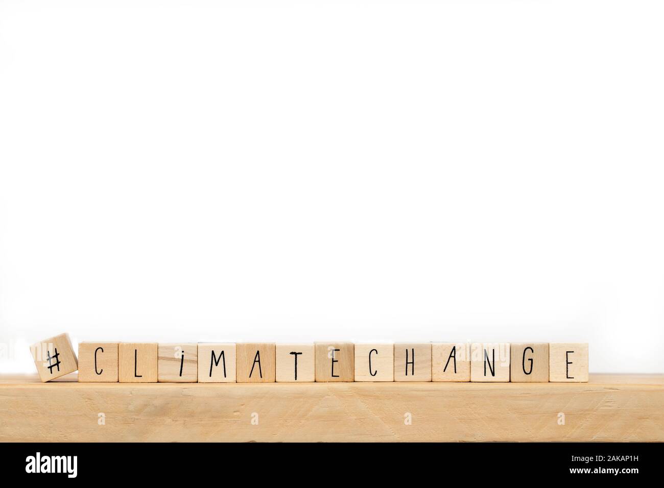 Wooden cubes with a Hashtag and the word Climate Change, social media ...