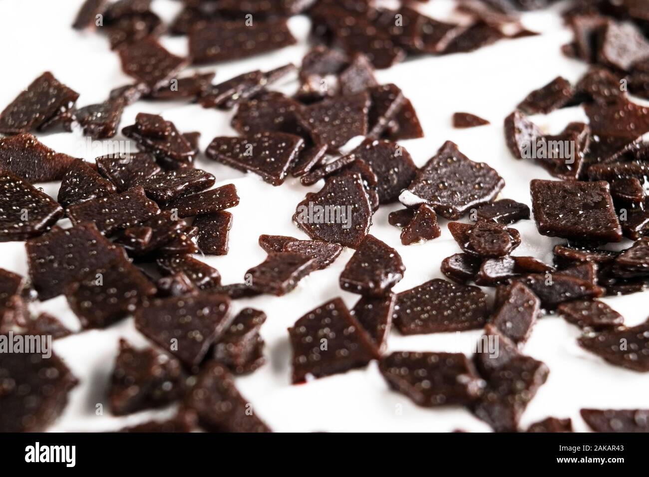 Grated chocolate. Pile of ground chocolate isolated on white background ...