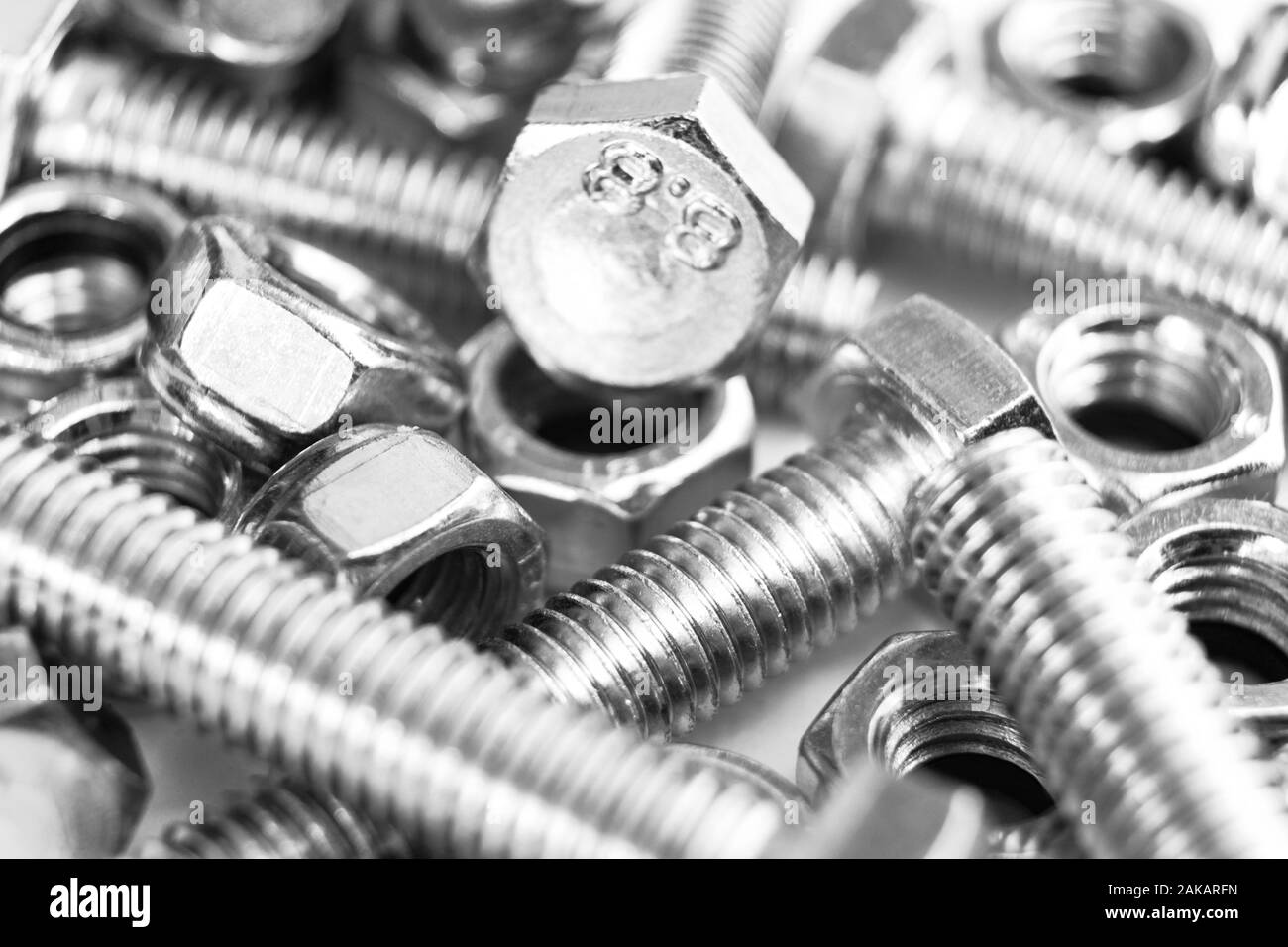 Metal bolts and nuts in a row background. Chromed screw bolts and nuts ...