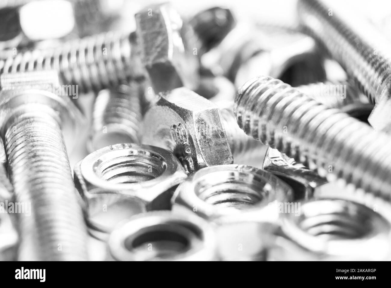 Metal bolts and nuts in a row background. Chromed screw bolts and nuts ...