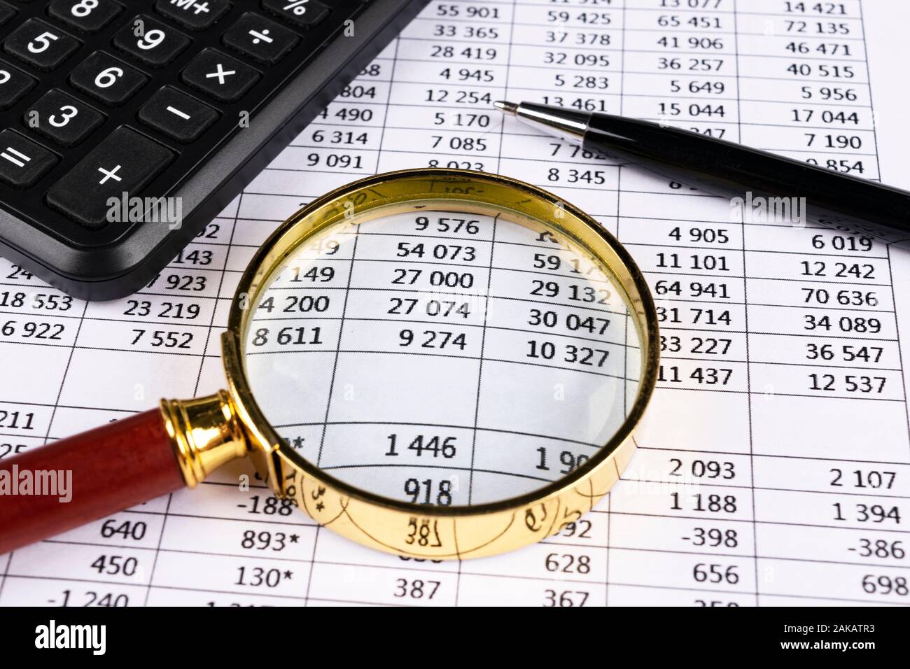 Financial concept. Calculator, pen and glasses on financial documents ...