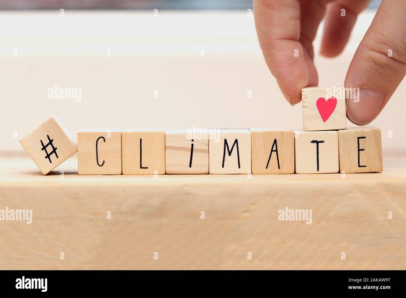 Wooden cubes with a Hashtag and the word Climate, social media and ...