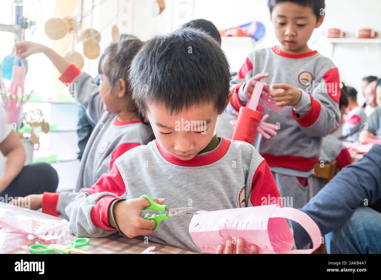 Kids in a public kindergarten are doing handworks in Shenzhen of ...
