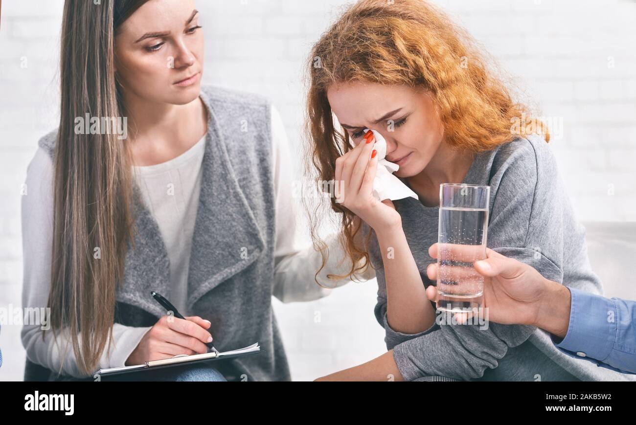 Therapist comforting crying patient hi-res stock photography and images ...