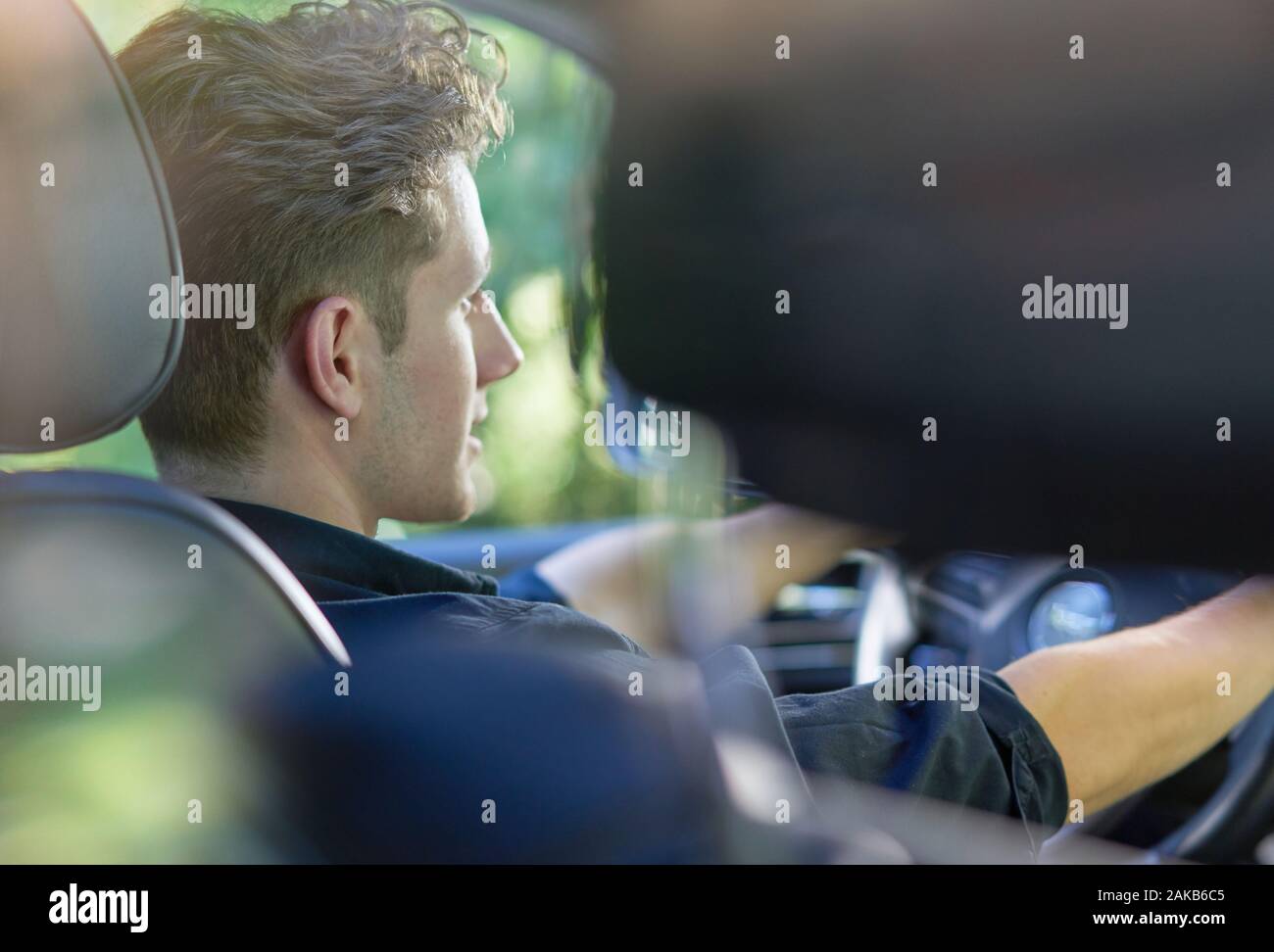 Happy young male driver hi-res stock photography and images - Alamy