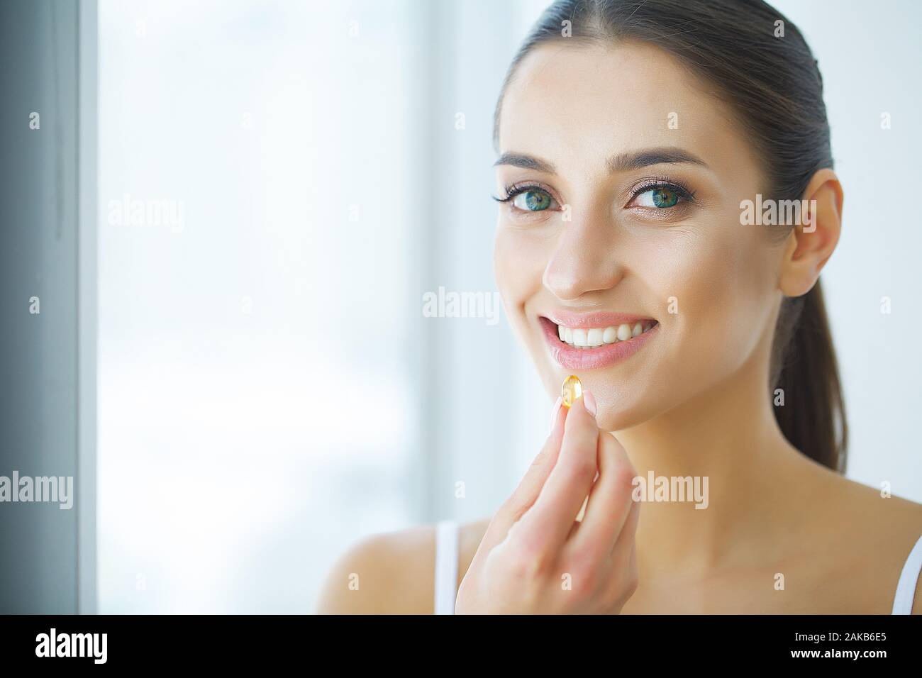 Beautiful Woman Taking Pill, Medicine. Vitamins And Supplements Stock ...