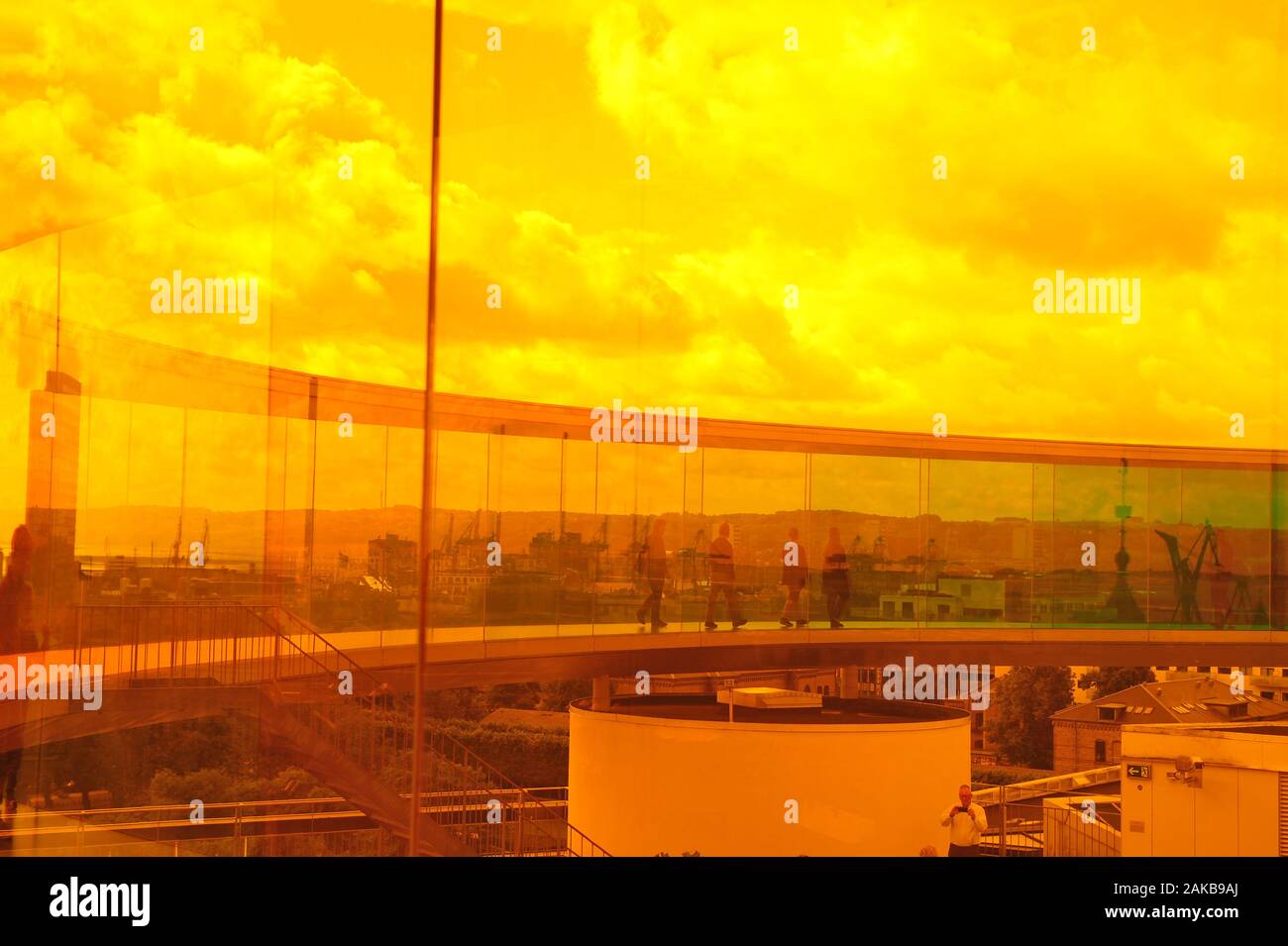 City view of Århus, Denmark. Photo taken through orange glass in the ...