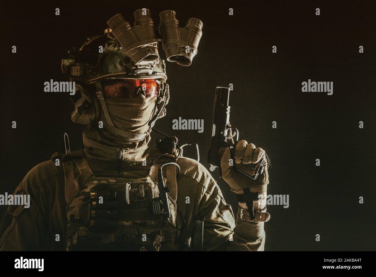 Combatant armed with service pistol in darkness Stock Photo - Alamy