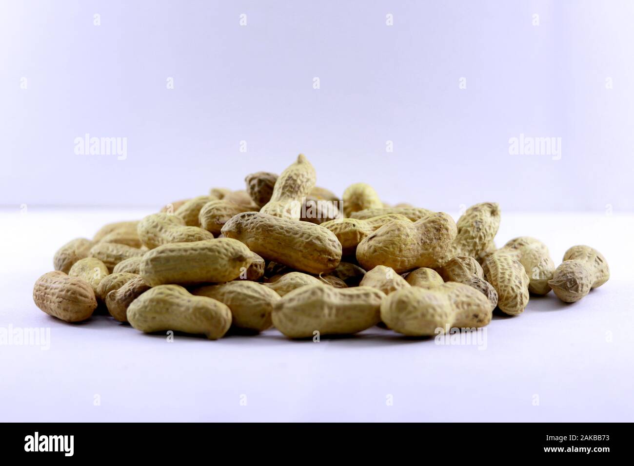 penuts isolated on a white background Stock Photo - Alamy