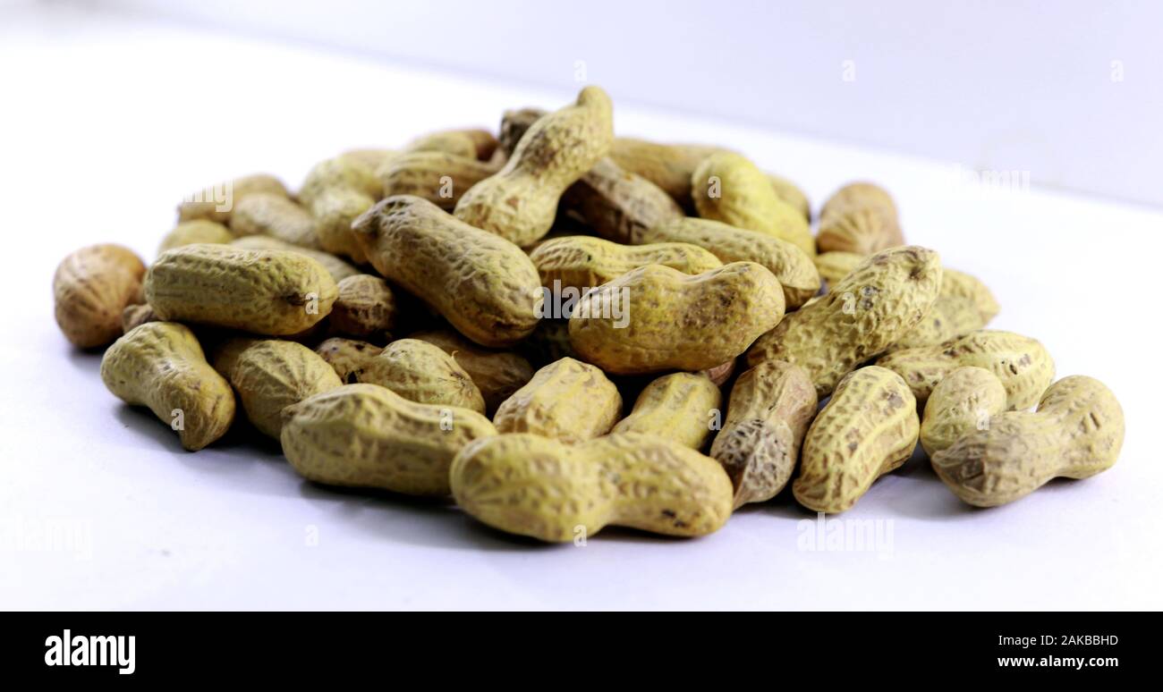 penuts isolated on a white background Stock Photo - Alamy