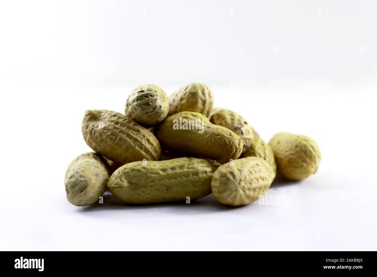 penuts isolated on a white background Stock Photo - Alamy