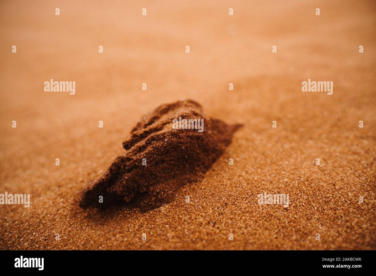 texture of red sand with structures and small stones Stock Photo - Alamy