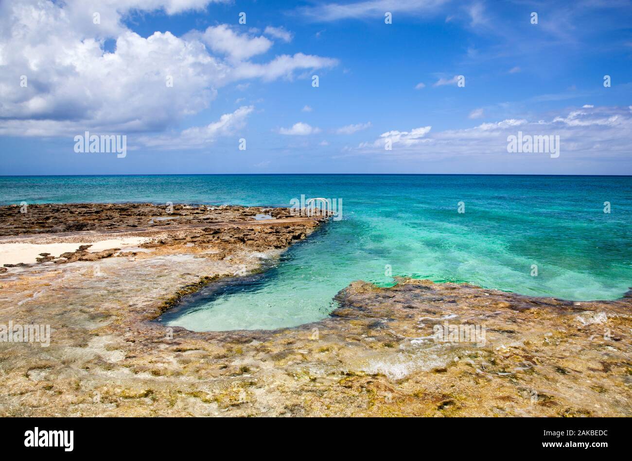 The rocky landscape with a ladder on Grand Cayman island Seven Mile ...