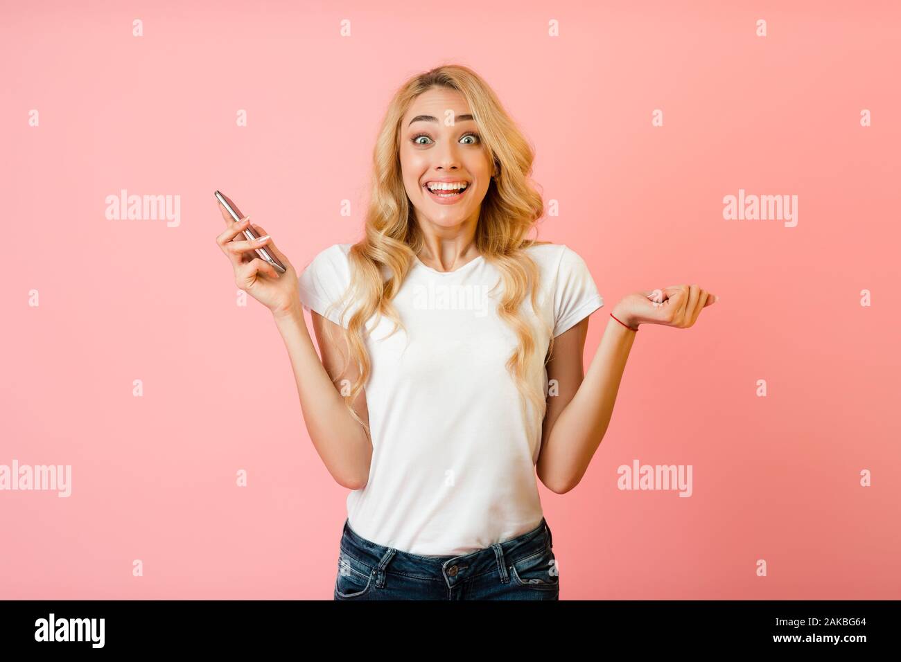 Great offer. Surprised woman with mobile phone shocked with sales. Girl ...