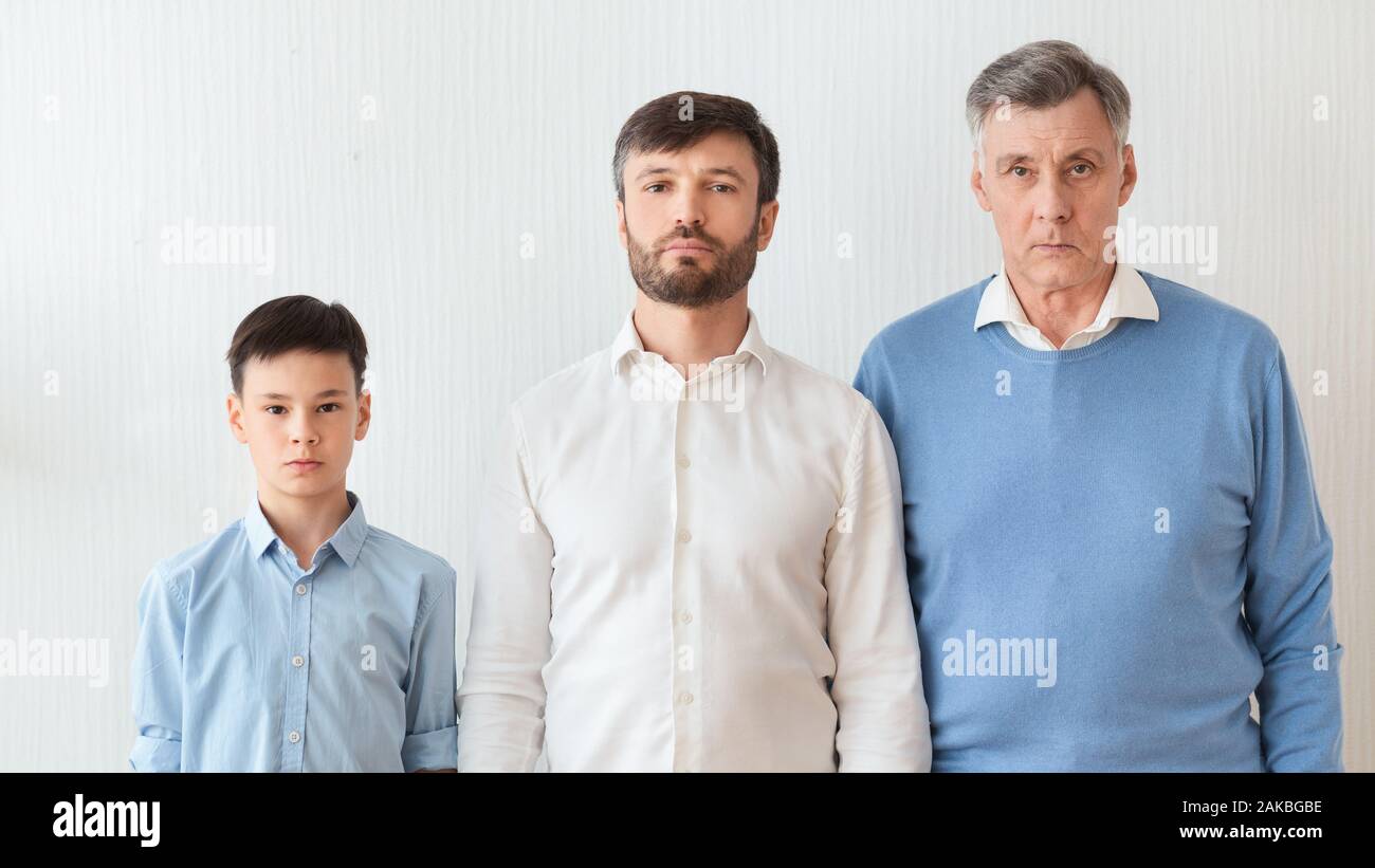 Male Generations. Serious Boy, Father And Grandfather Standing Looking ...
