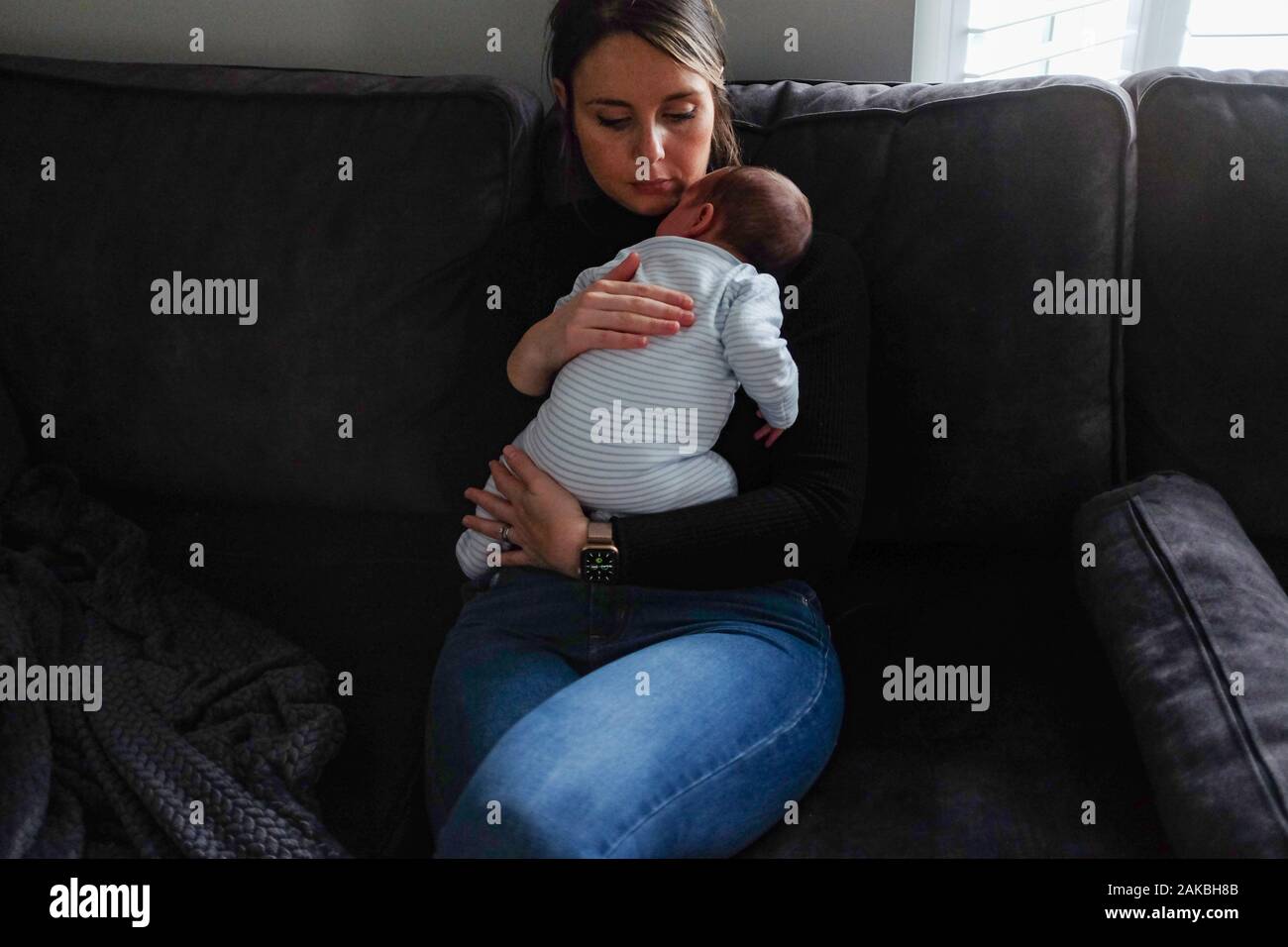 Young mother with her new baby son of 1 month old Stock Photo - Alamy