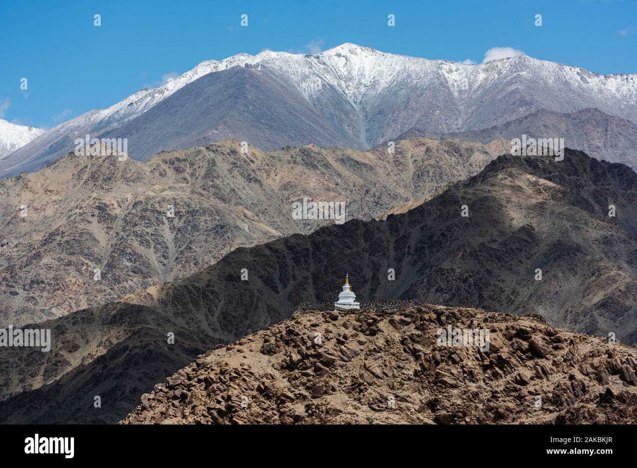 White stupa temple in a wild mountain landscape Stock Photo - Alamy