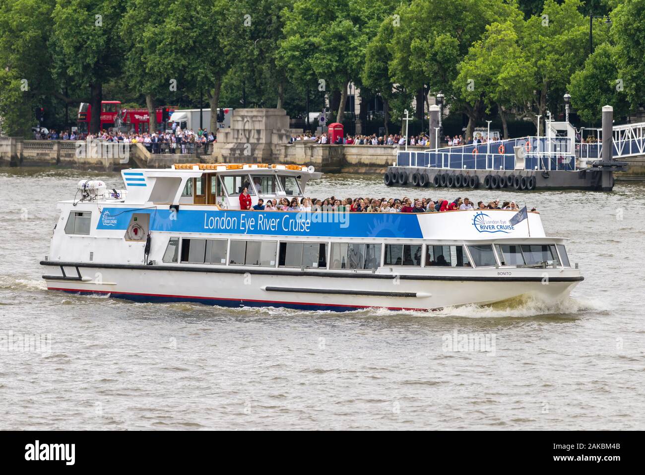 A London Eye River Cruise boat sailing on the river Thames with ...