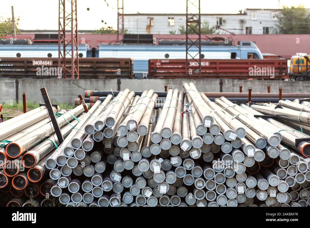 Metal rolling. Pipes folded in a railway warehouse are being prepared ...