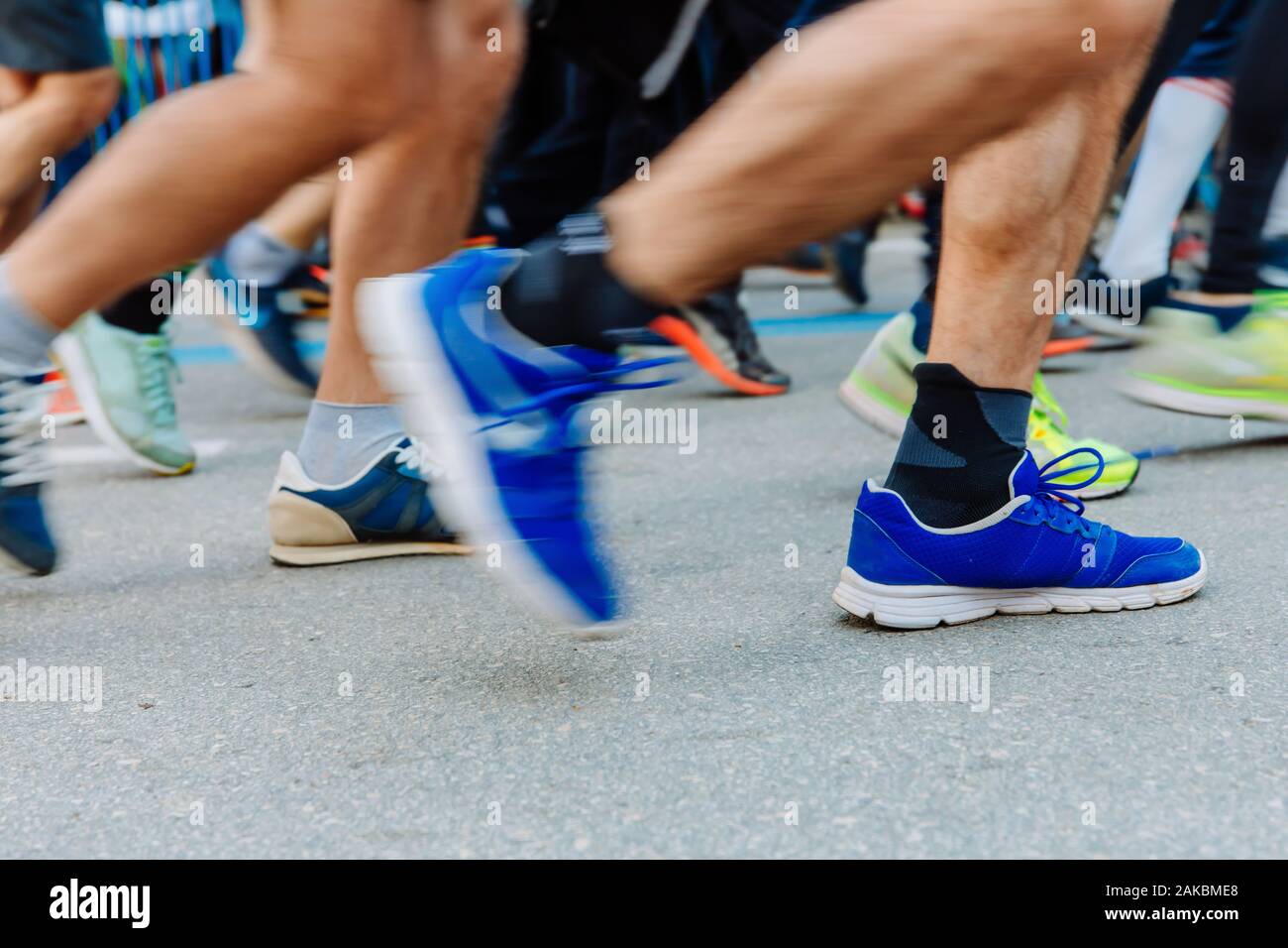 Marathon runners running at public city marathon. Marathon runners and ...