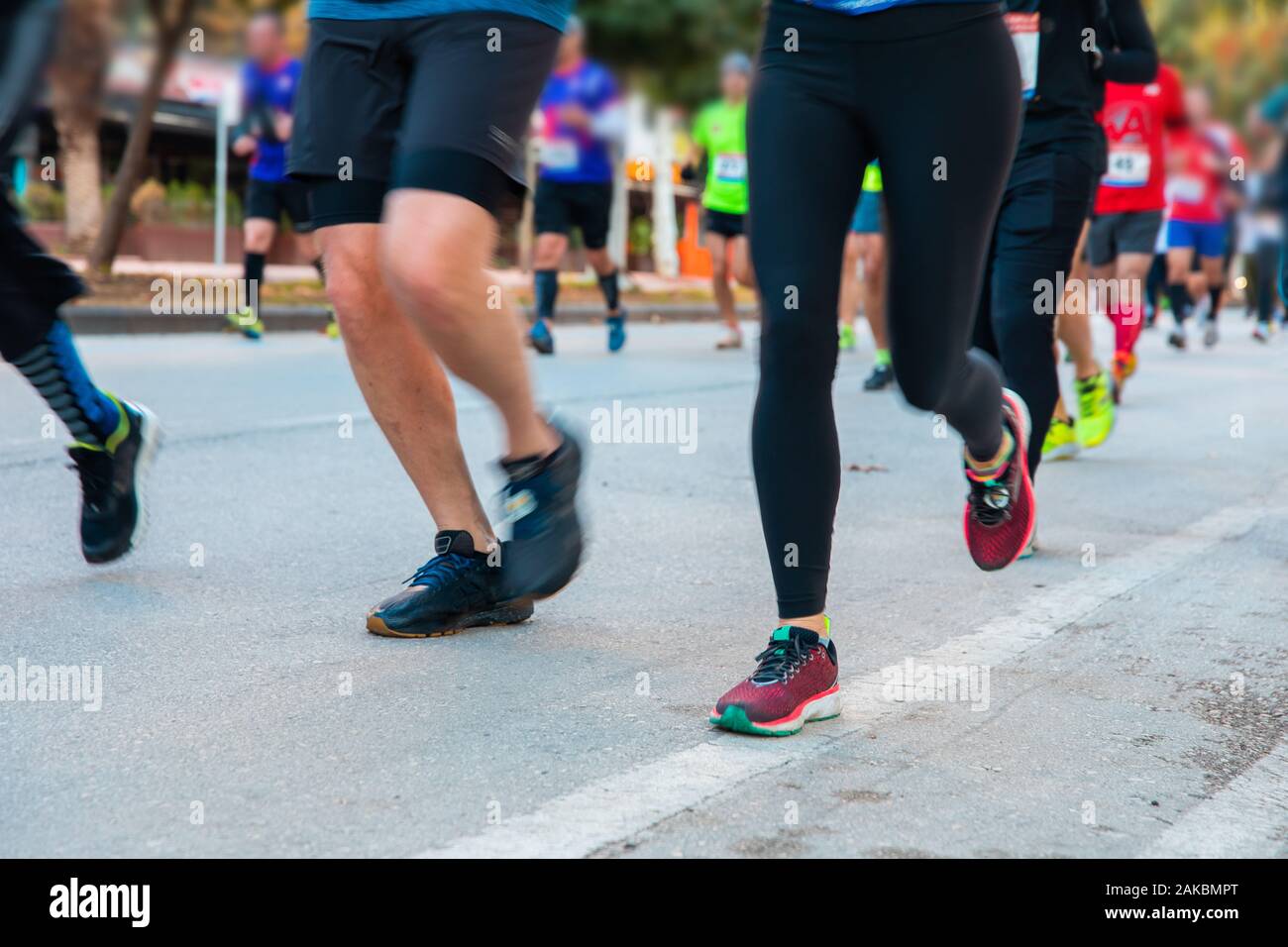 Marathon runners running at public city marathon. Marathon runners and ...