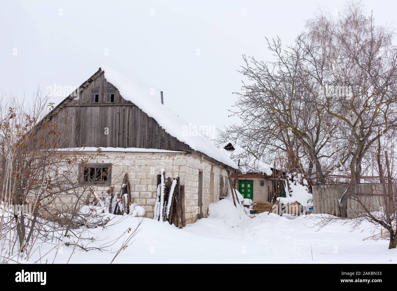 Winter countryside landscape, dilapidated abandoned ruined building ...