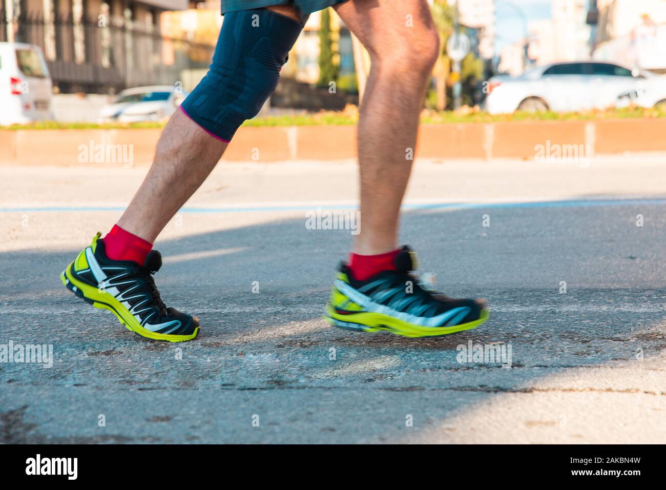 Marathon runner running at public city marathon. Marathon runner and ...