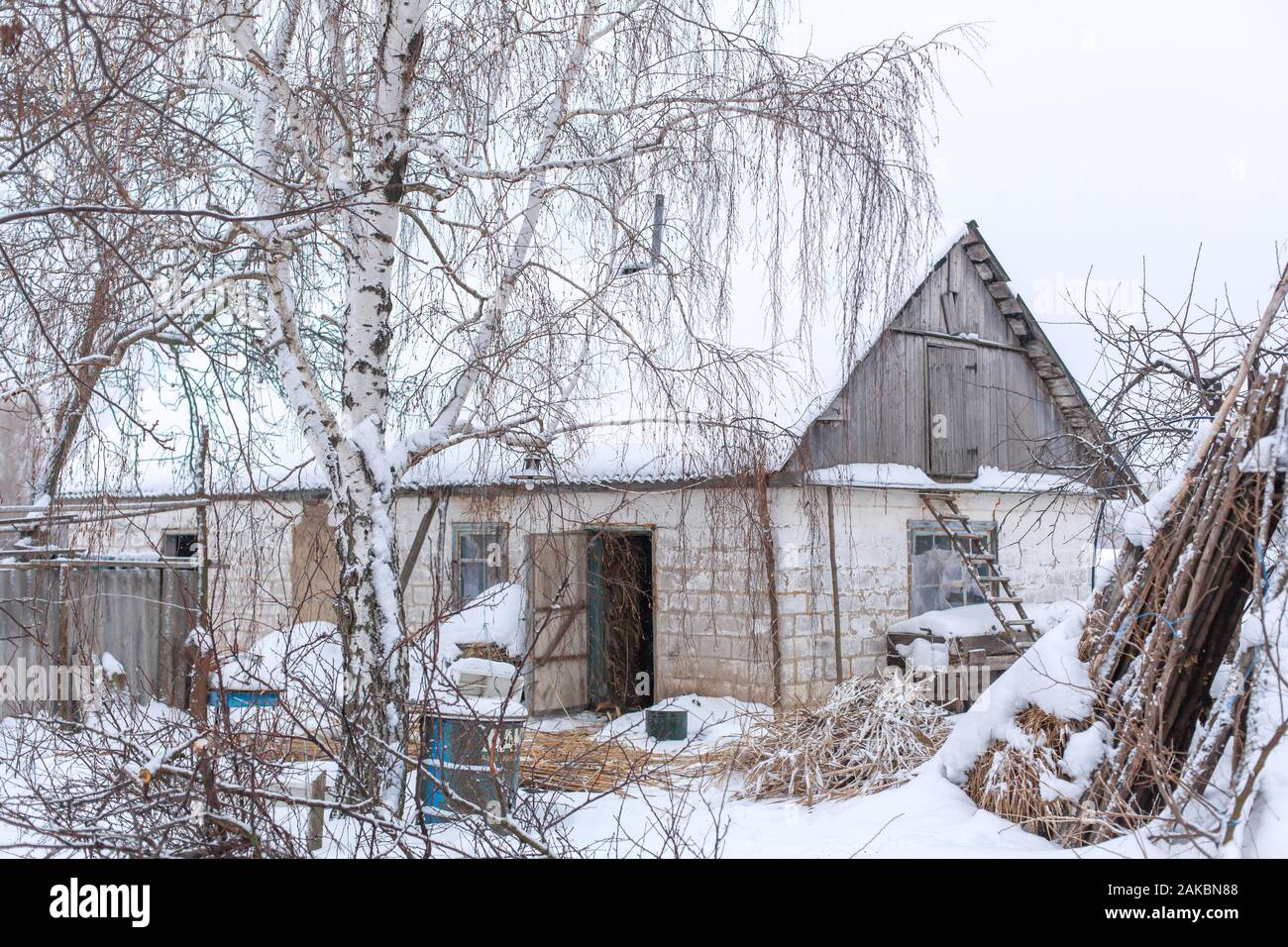 Winter countryside landscape, dilapidated abandoned ruined building ...