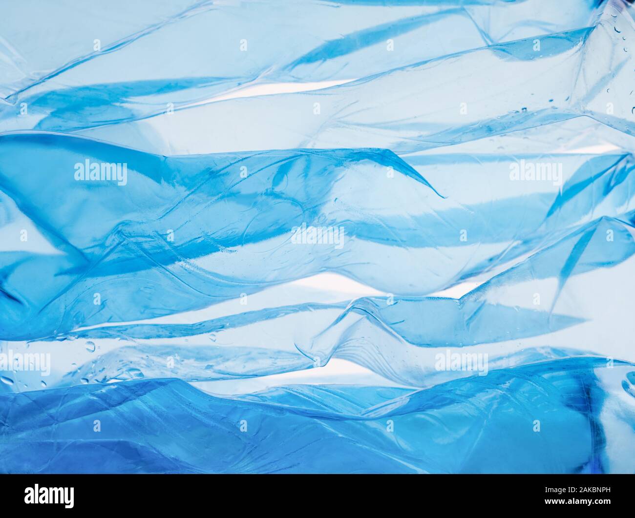 Recycling concept. Patterns of Blue plastic bottles fulling white ...