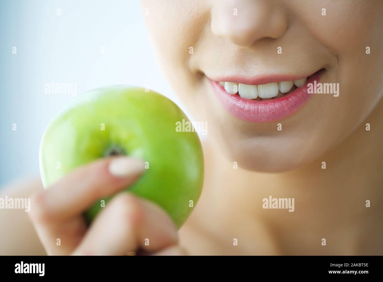 Woman Eating Apple. Beautiful Girl With White Teeth Biting Apple. High ...