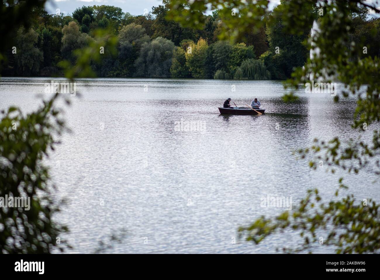 Two men fishing on a lake in Berlin Stock Photo - Alamy