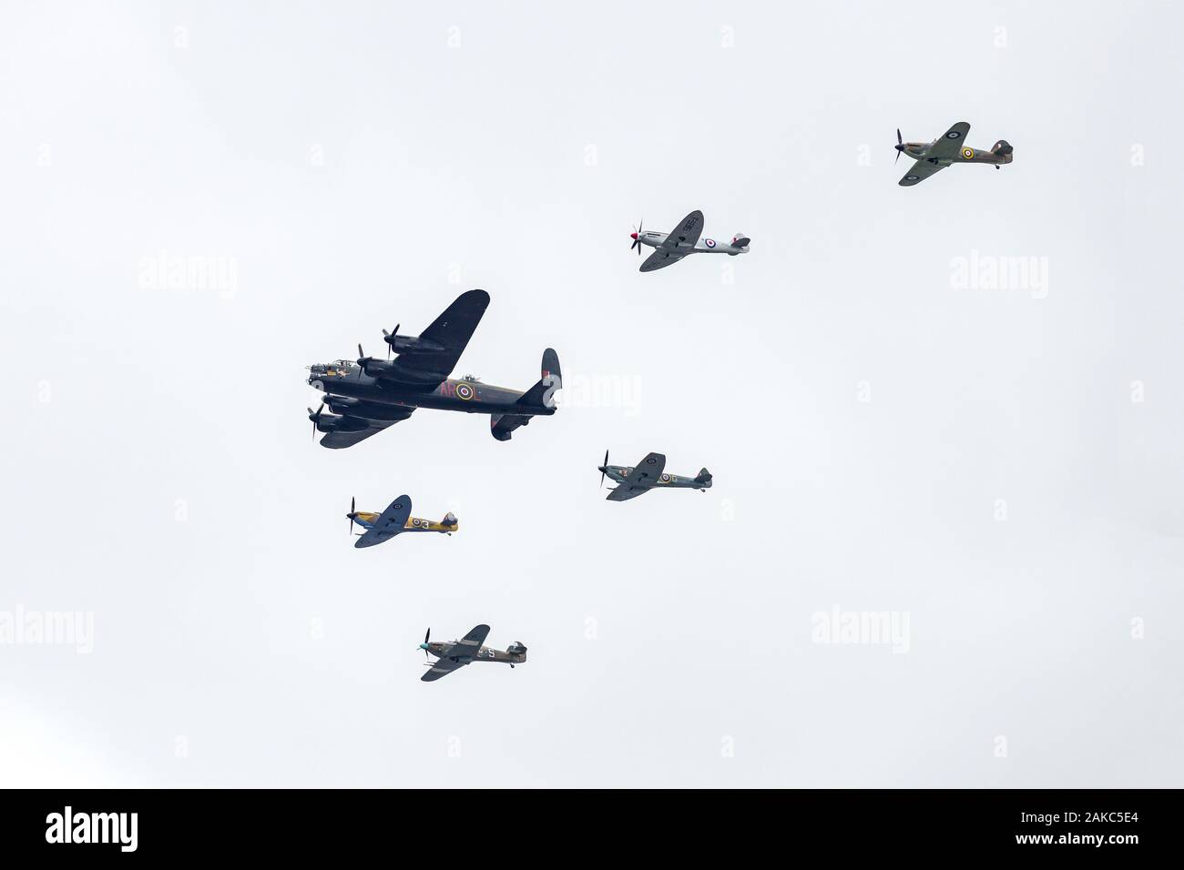 RAF Lancaster bomber in display formation with Spitfire fighters flying ...