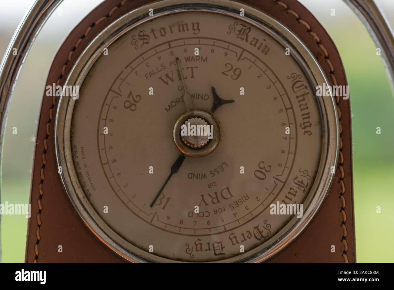 Close up of an old antique barometer made out of an old horses stirrup ...