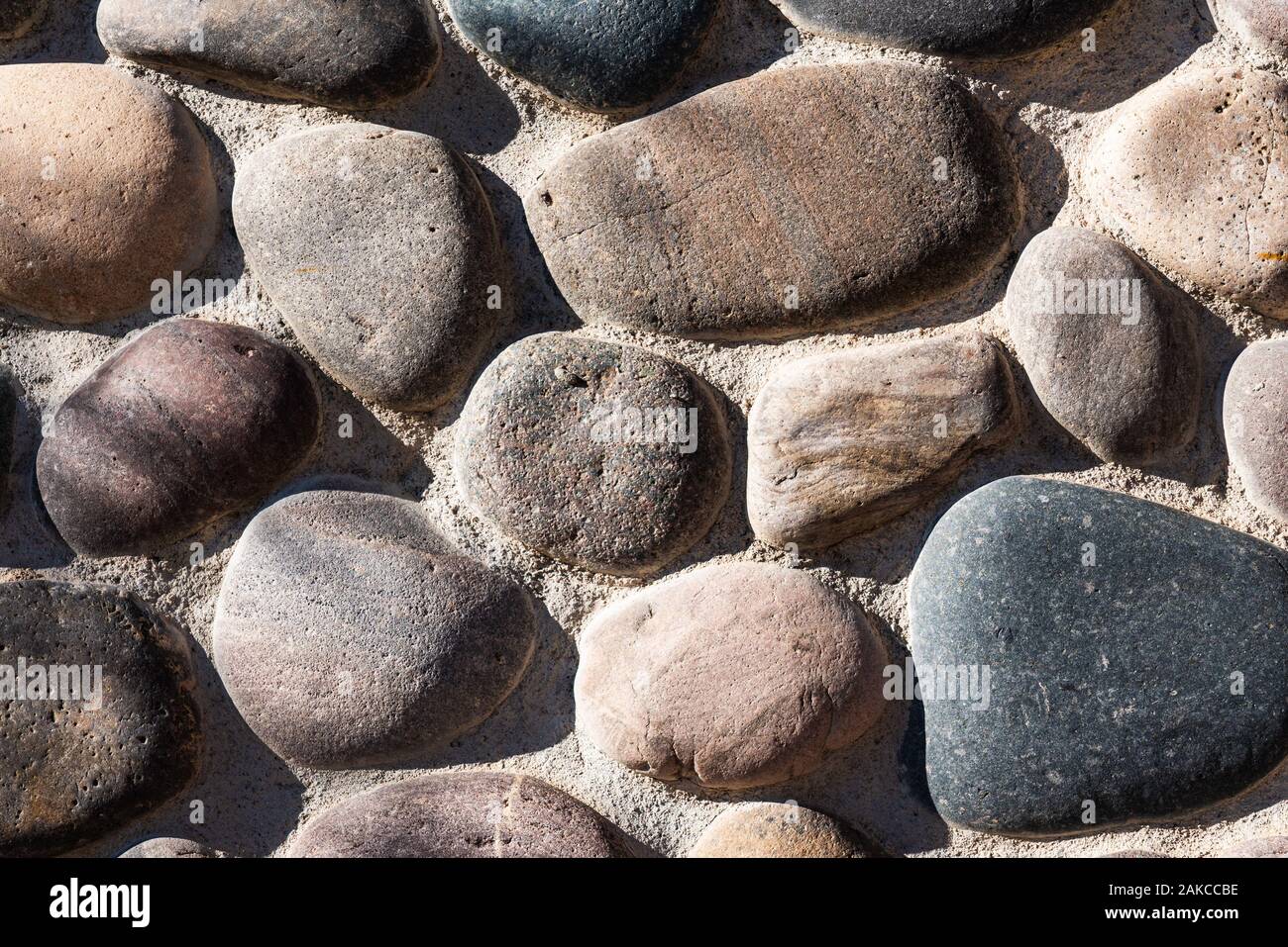 Stone wall rounded stones hi-res stock photography and images - Alamy