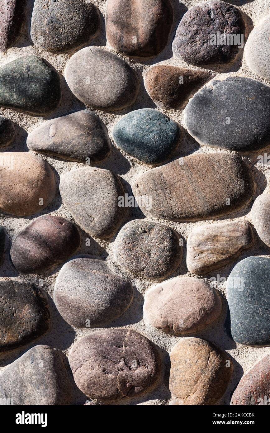 Stone wall rounded stones hi-res stock photography and images - Alamy