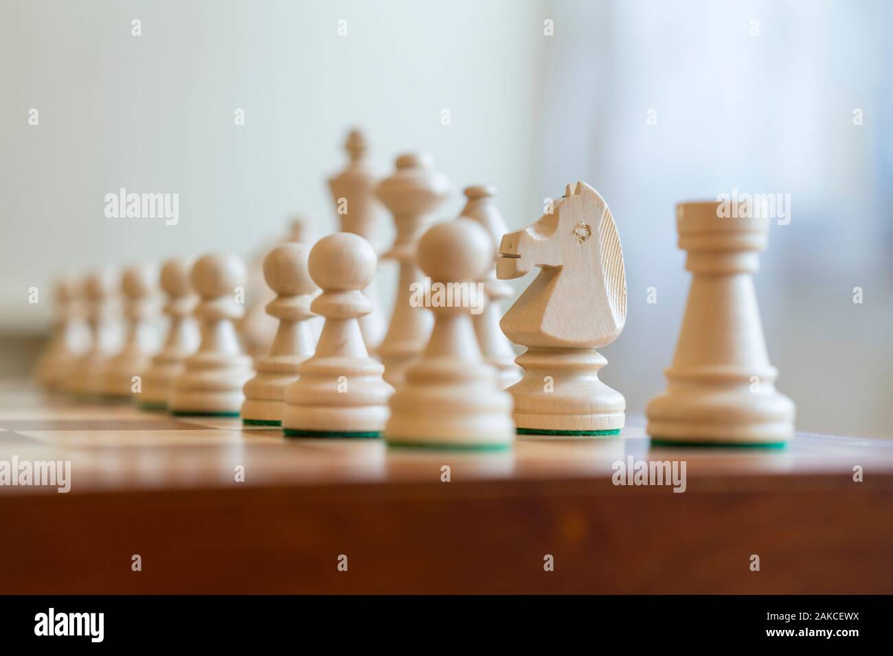 White Chess Pieces on a Chess Board Stock Photo - Alamy