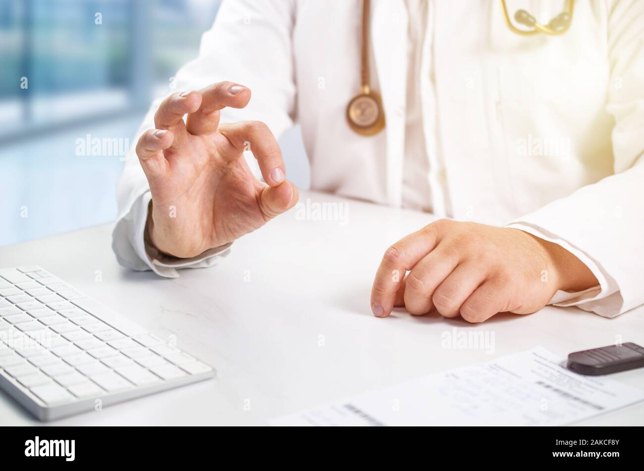 Male doctor shows ok gesture, medicine background Stock Photo - Alamy