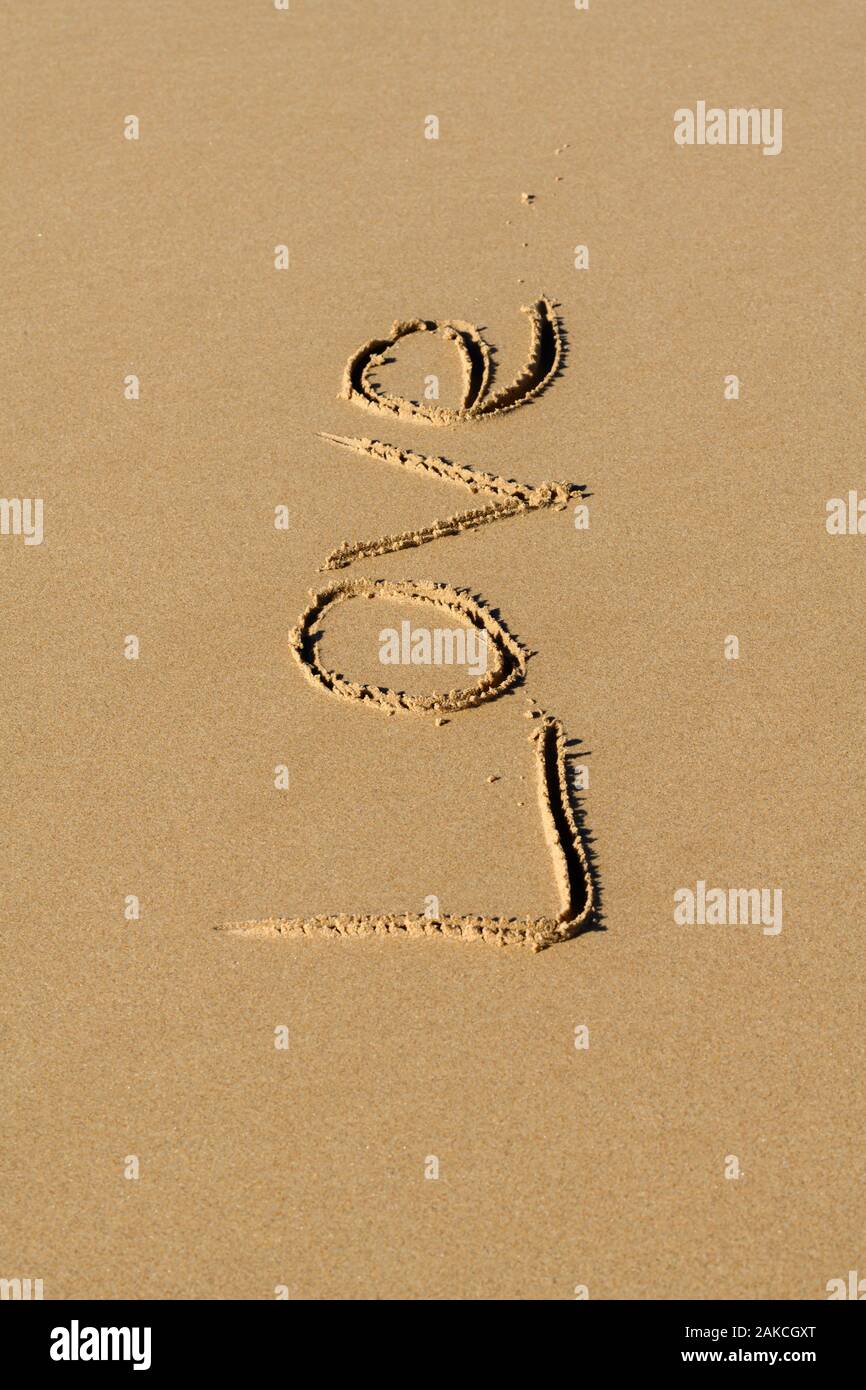 Love words in sand Stock Photo - Alamy