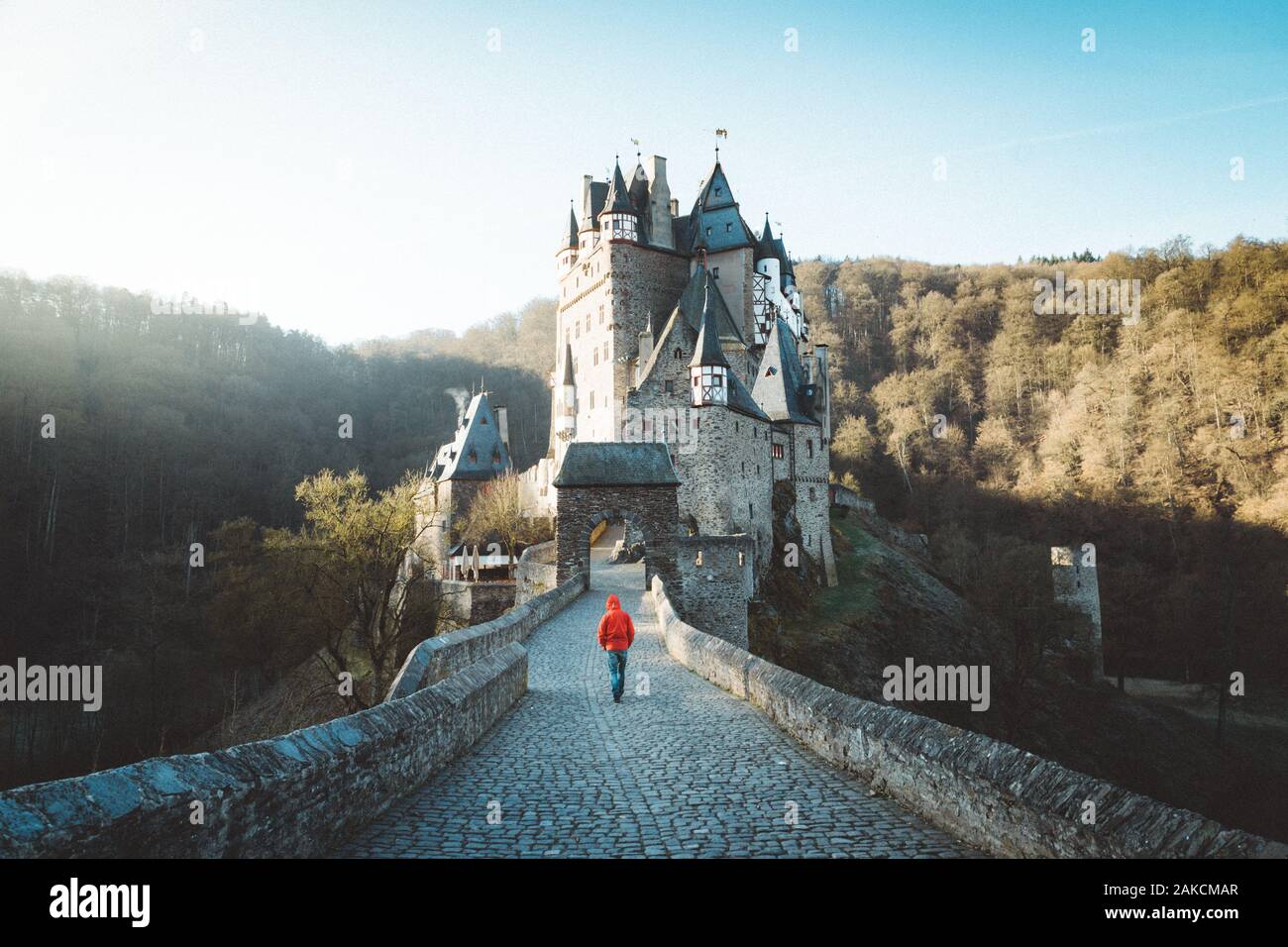 Panorama view of young explorer with backpack taking in the view at ...