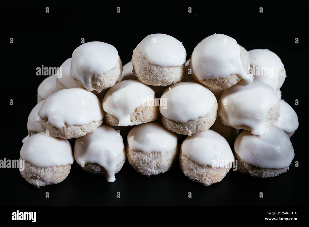 Small round coconut biscuits on the dark background Stock Photo - Alamy