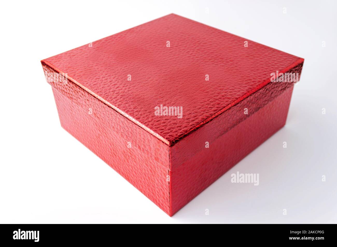 Single red color gift paper cardboard leather embossed box on white ...
