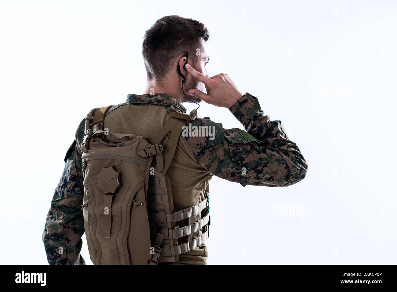 soldier preparing tactical and commpunication gear for action battle ...