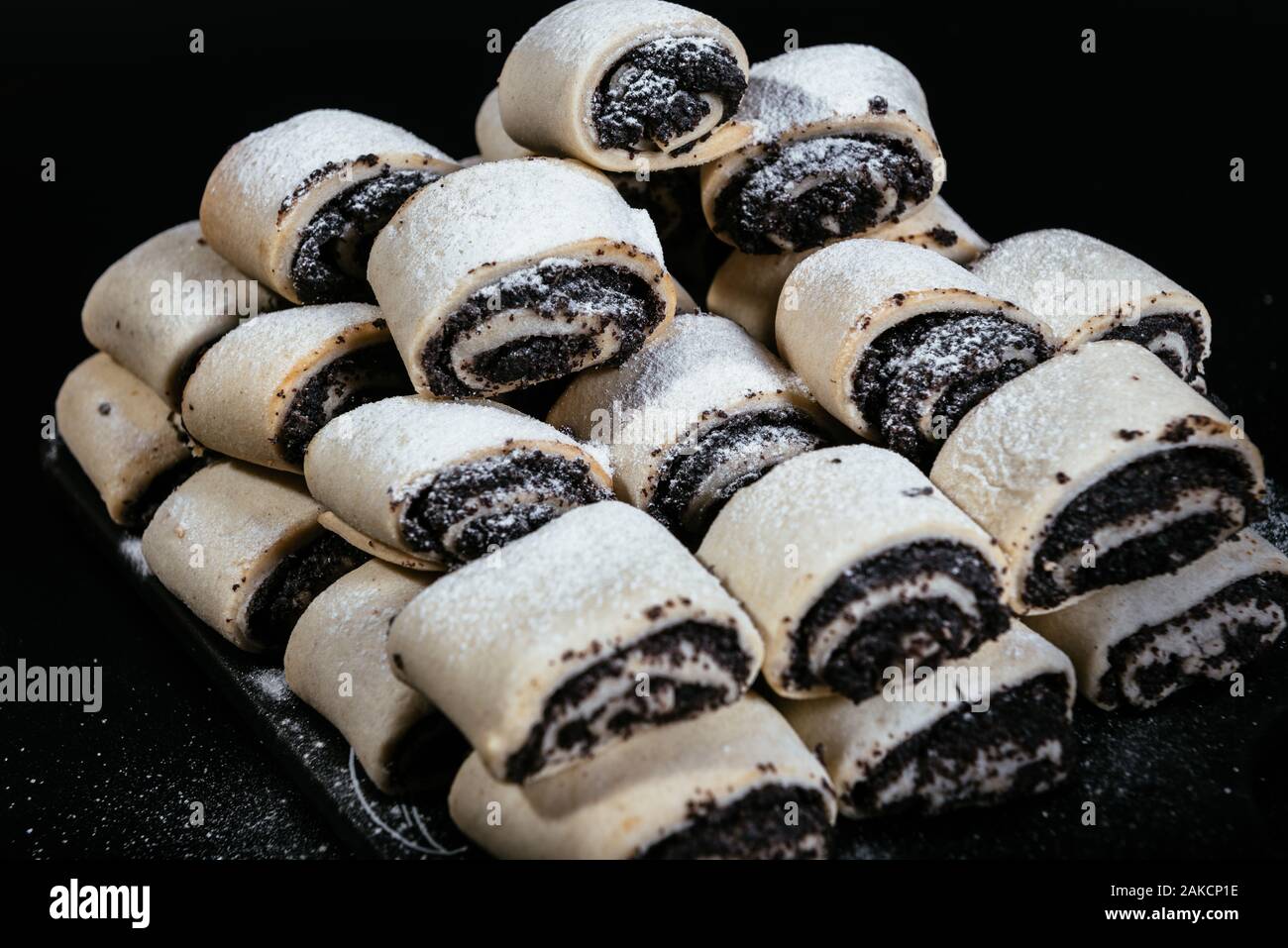 Group of poppy rolls on the dark background Stock Photo - Alamy