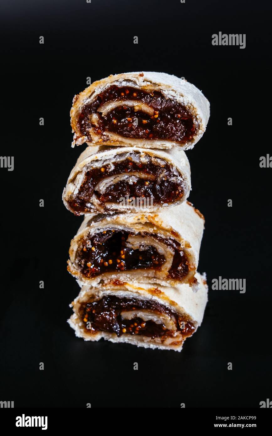 Fresh fig rolls on the dark background Stock Photo - Alamy