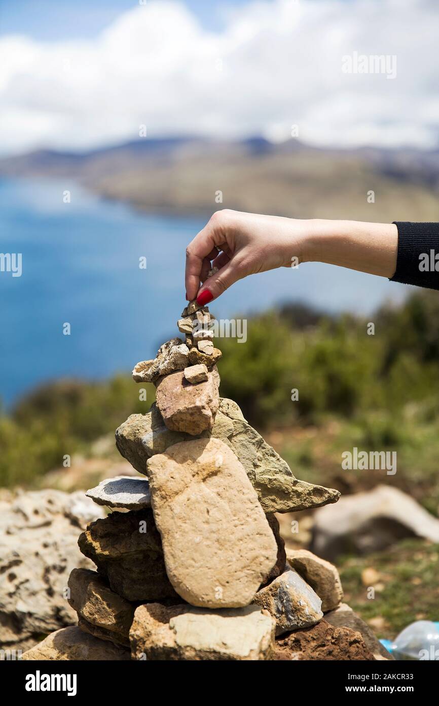Hand stacking stones hi-res stock photography and images - Alamy