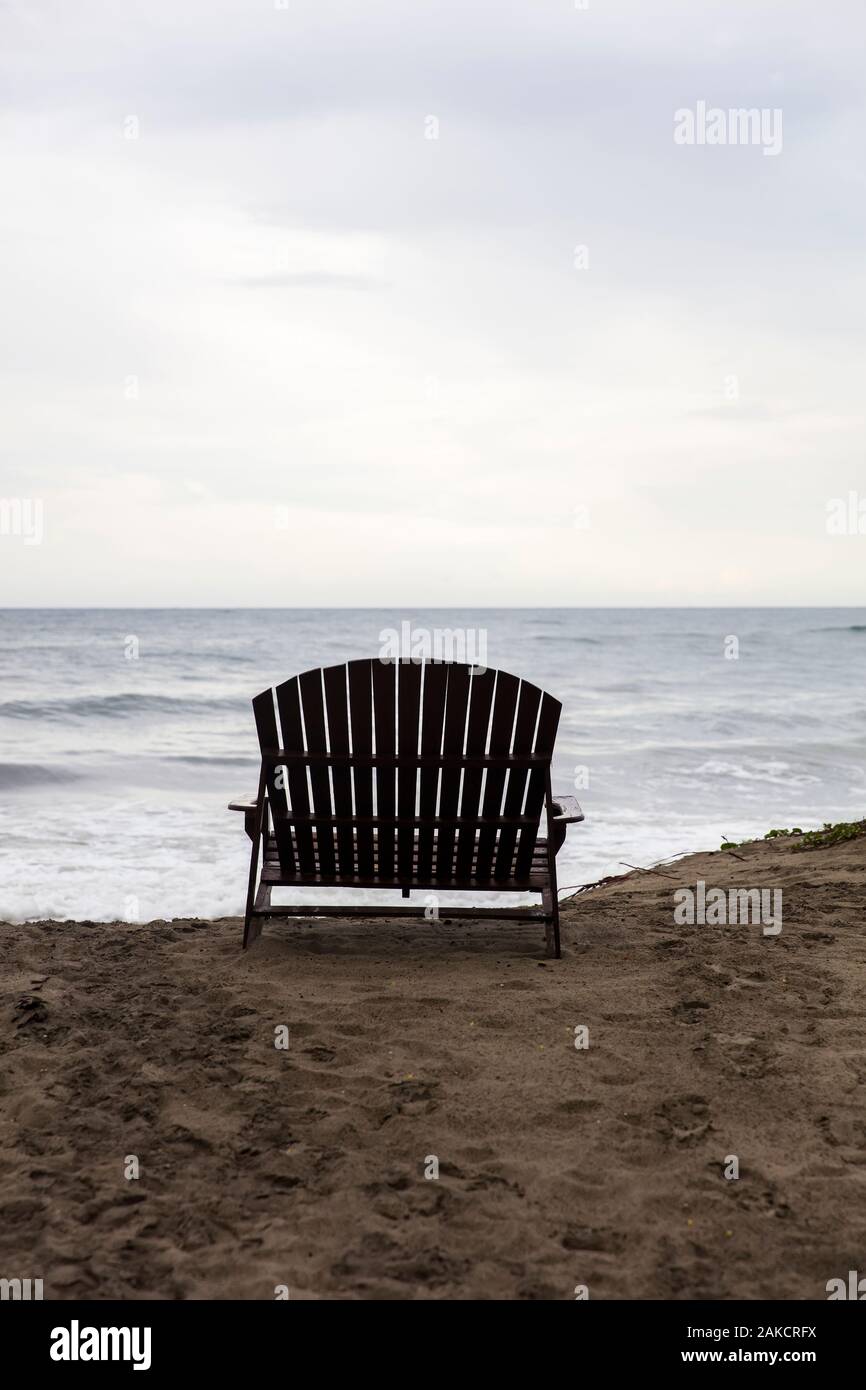 Old stylish wooden chair on the tropical beach in Santa Marta, Colombia ...