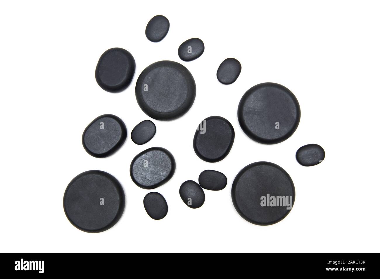 Volcanic hot stone massage stones on the white background Stock Photo ...
