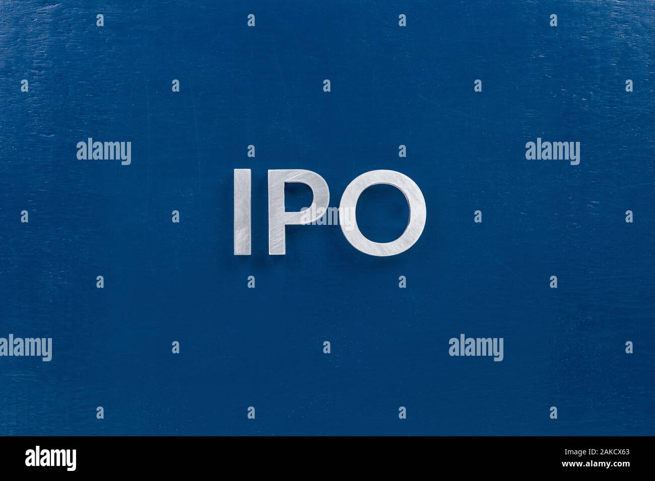 the abbreviation ipo - initial public offering - laid with silver metal ...