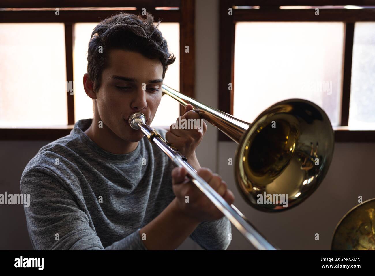 Musician holding trombone hi-res stock photography and images - Alamy